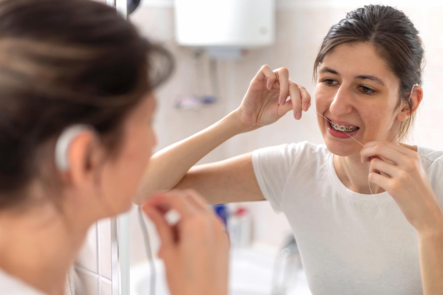 Learn How to Floss with Braces